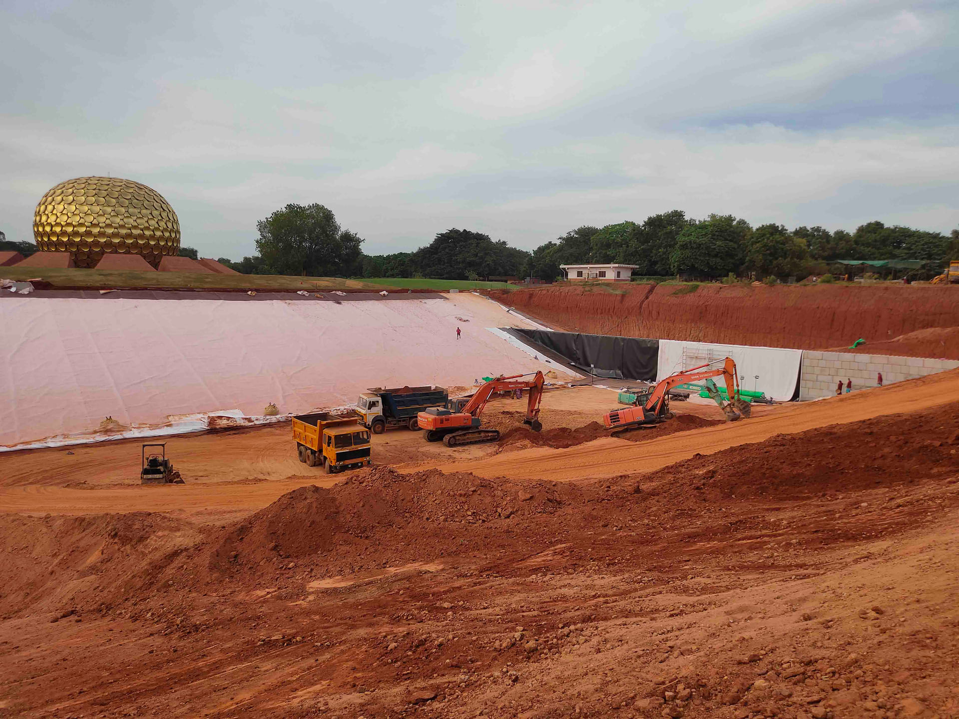 The first section of the Matrimandir test lake nears completion ...